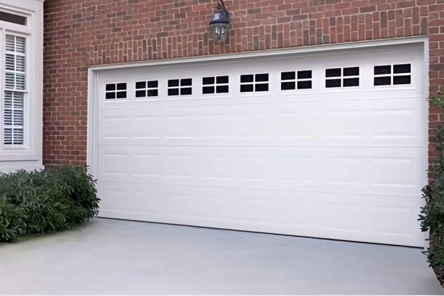 Modern Sandstone Garage Door with Sunray Windows